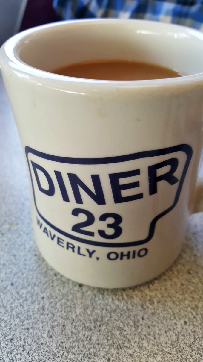 That classic diner mug—holding liquid motivation that's been fueling road trips and curing hangovers since before Instagram existed.