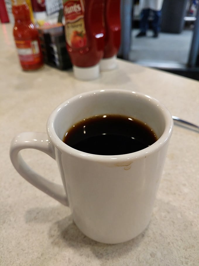 The humble diner coffee mug &ndash; unassuming vessel of liquid ambition, morning meditation, and the universal signal for "don't talk to me yet."