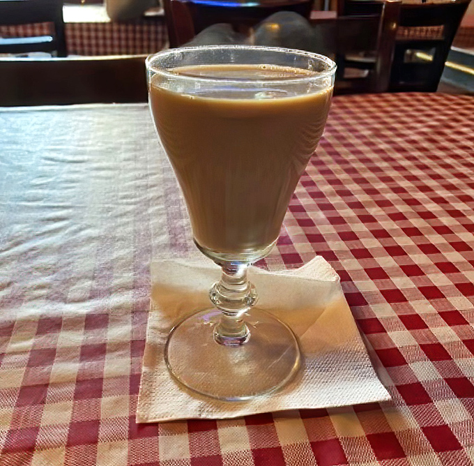 Coffee served in a proper glass, on a proper tablecloth &ndash; a civilized moment in an increasingly uncivilized world.