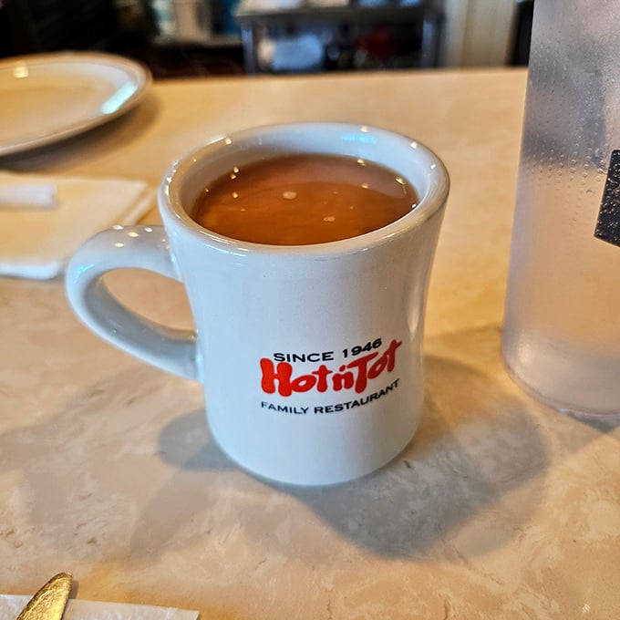 The official Hot N Tot mug&mdash;holding what might be the most honest cup of coffee in Los Angeles County.