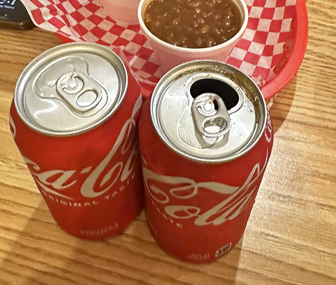 Even the beverages know their role. These ice-cold Cokes stand ready to cut through the richness of smoked meat like faithful sidekicks.