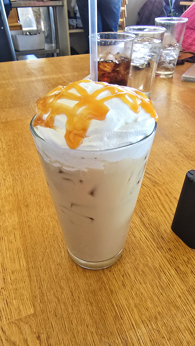 Cold brew topped with whipped cream and caramel &ndash; because sometimes coffee should wear a party hat and remind you that mornings can be fun.