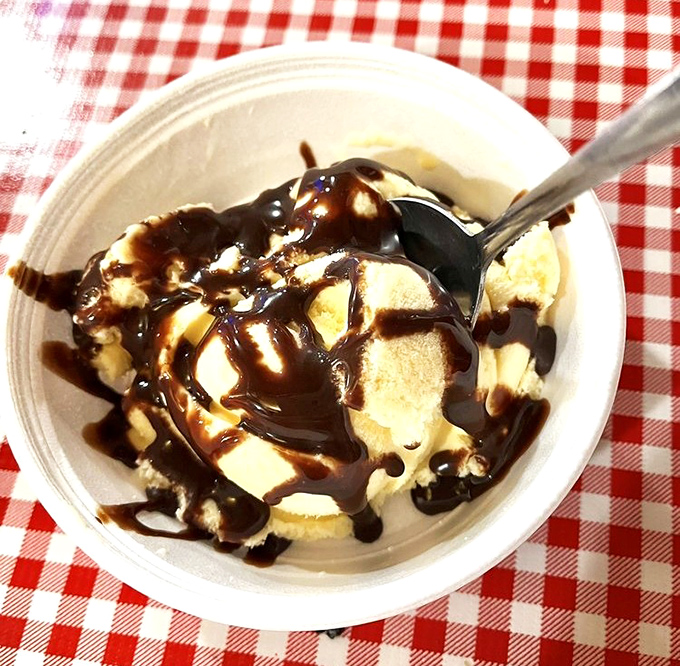 Ice cream drizzled with chocolate sauce—because after conquering mountains of barbecue, you deserve a sweet victory lap around this simple pleasure.