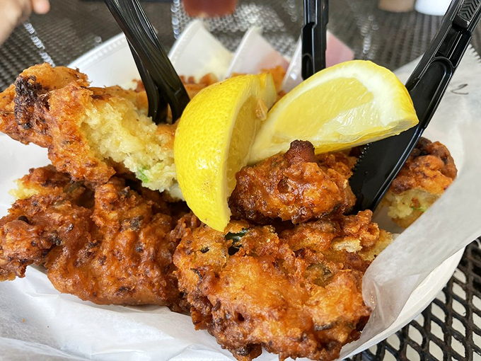 Golden-brown conch fritters with a squeeze of lemon – crunchy outside, tender inside, and worth every mile of the drive to get here.