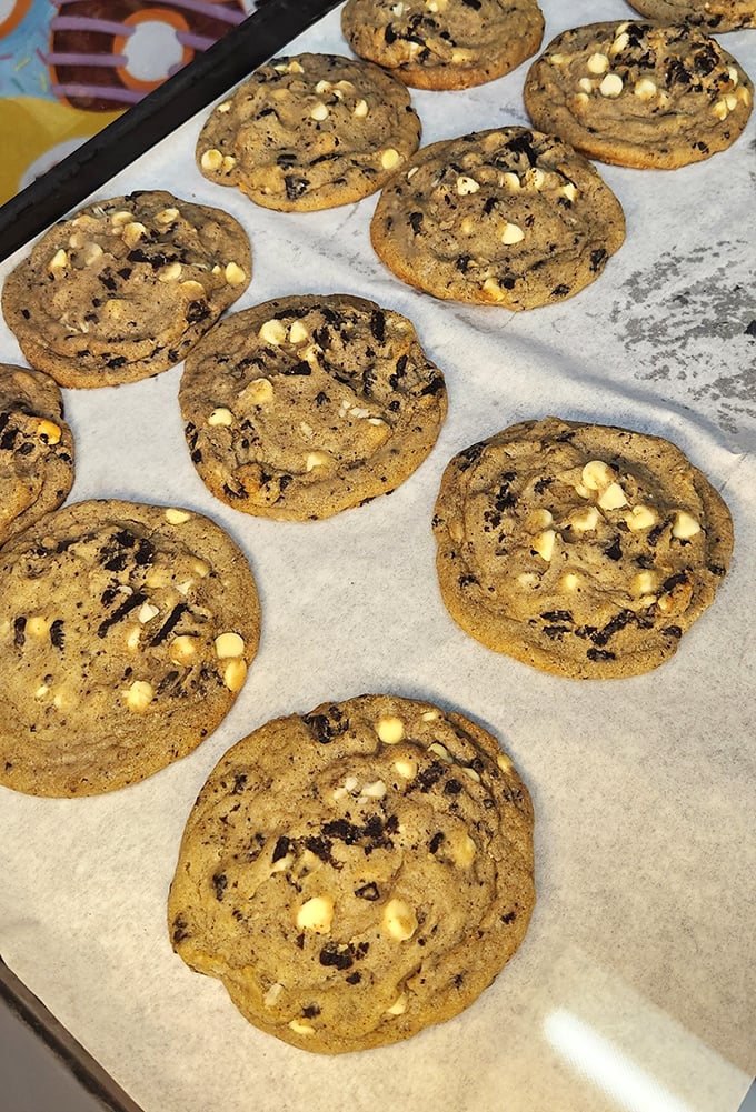These cookies aren't just baked; they're engineered for maximum chocolate chip distribution. The white chocolate chunks are bonus treasure.