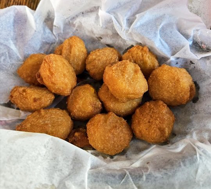 Hush puppies that don't just request silence&mdash;they demand it with their crispy exterior giving way to a tender cornmeal center worth contemplating.