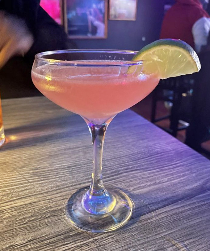 A cocktail that says "I'm sophisticated" while the bacon-centric meal you ordered screams "but I have priorities!" Perfect pink balance in a world of extremes.