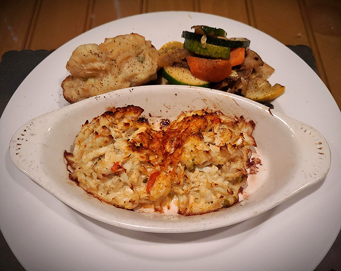 Crab Imperial: where sweet crabmeat bathes luxuriously in a creamy sauce that would make Neptune himself request seconds.