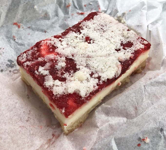 This cream cheese cherry bar doesn't just satisfy a sweet tooth &ndash; it creates a cult following. The crumb topping is practically a religious experience.