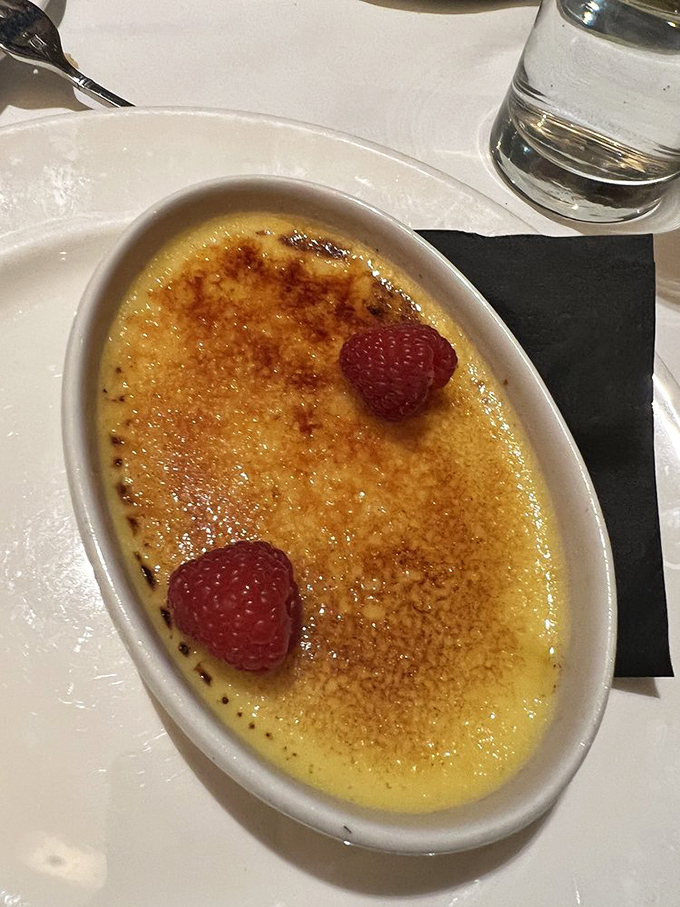 The cr&egrave;me br&ucirc;l&eacute;e's crackling sugar top gives way to silky custard beneath&mdash;like breaking through ice to find treasure.