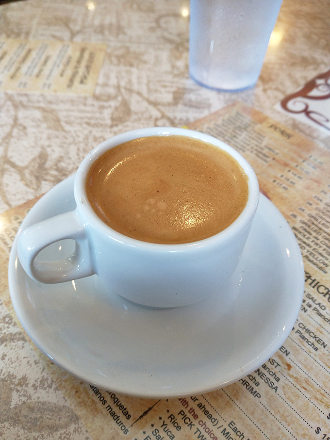 Cuban coffee—the liquid equivalent of jumper cables for your soul, served in a cup barely bigger than a thimble.