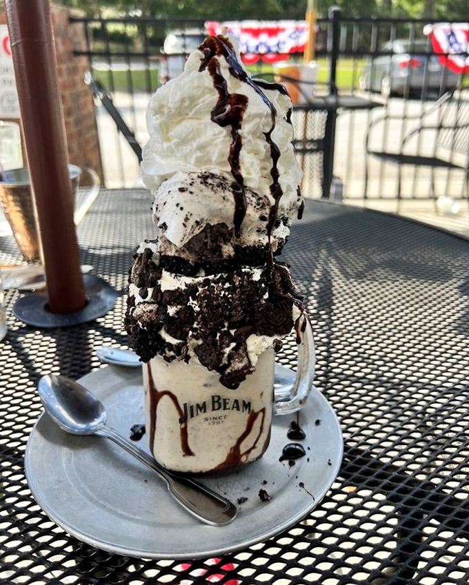 Oreo shake architecture that defies gravity and common sense. The whipped cream mountain alone deserves its own zip code.