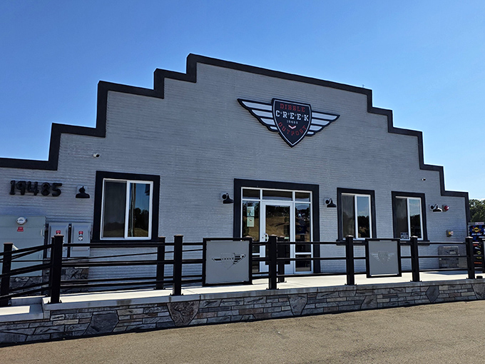 Dibble Creek Outpost stands like a friendly sentinel on the highway, its clean white fa&ccedil;ade practically begging for a road trip pit stop.