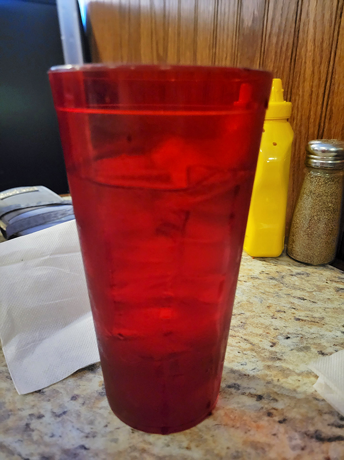 That red drink isn't just refreshing; it's a time machine. One sip and you're transported to simpler days when calories were just numbers and joy was measured in refills.