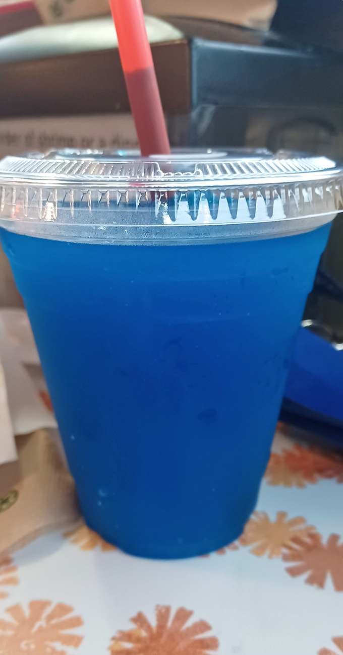 That electric blue drink isn't just a beverage&mdash;it's a nostalgic flavor flashback that pairs surprisingly well with savory fried goodness.