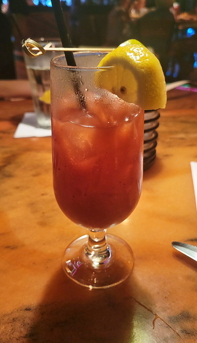 A perfectly mixed cocktail that captures the sunset colors of Myrtle Beach. That generous lemon wedge isn't just garnish &ndash; it's an exclamation point on vacation in a glass.