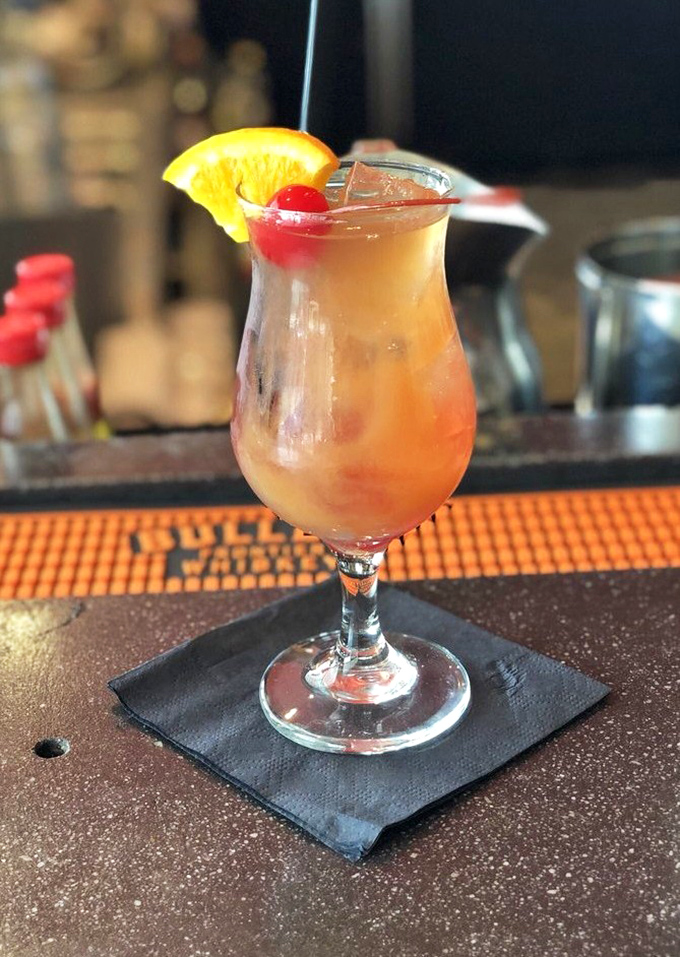 A sunset in a glass with a cherry on top. This cocktail provides the perfect counterpoint to smoky barbecue—sweet relief for your taste buds.