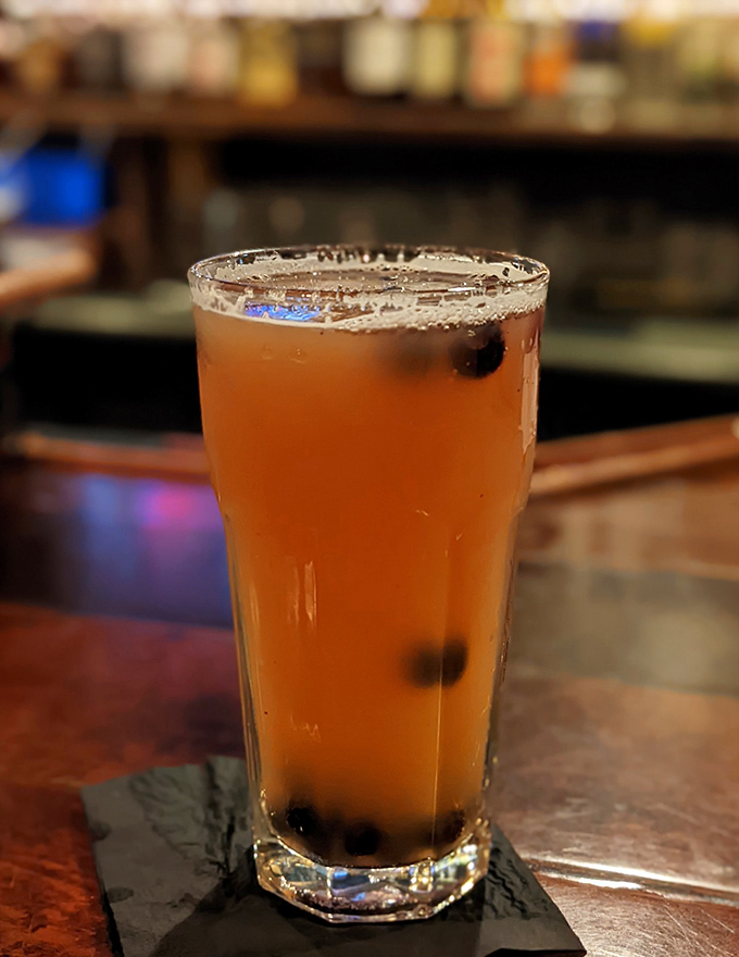 A perfectly poured beer complements the smoky feast, because great barbecue deserves an equally refreshing cold companion.