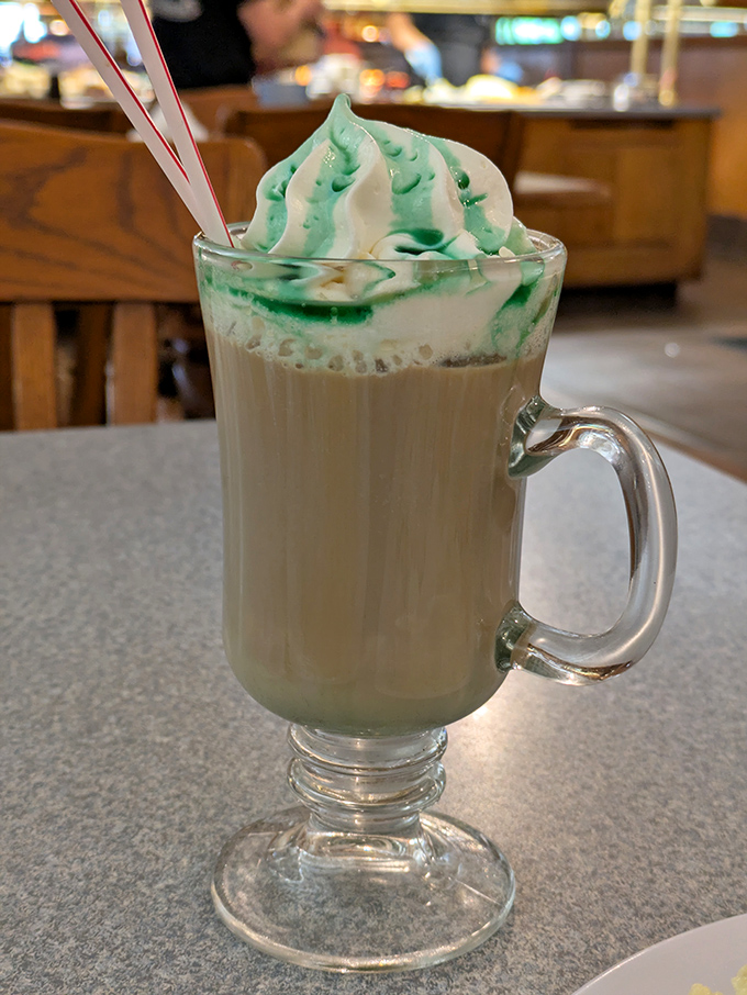 A festive drink topped with whipped cream and green swirls &ndash; because sometimes your sweet tooth deserves its own happy hour.