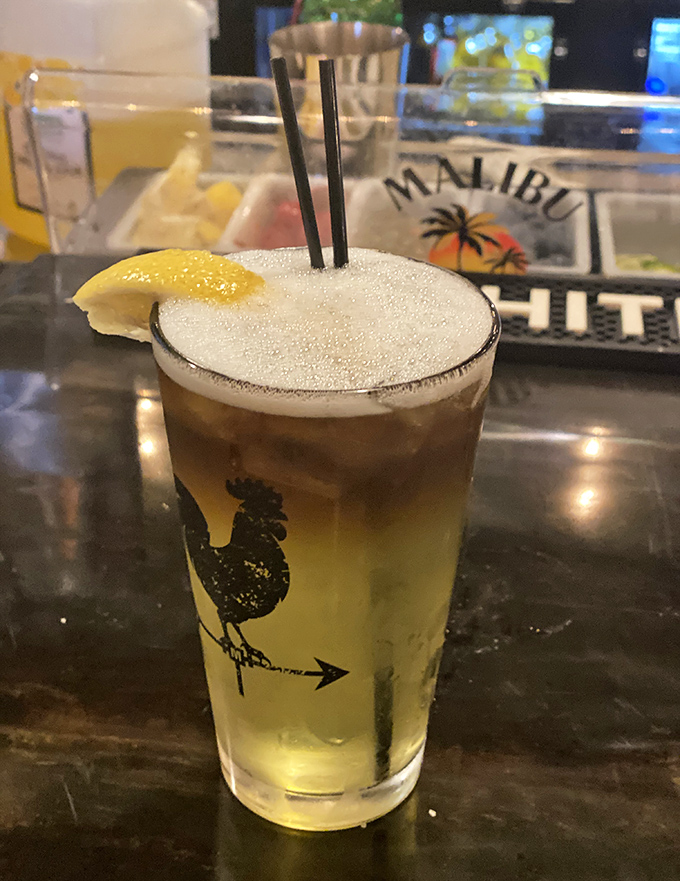 A perfectly crafted cocktail with a frothy top and citrus garnish&mdash;because sometimes the best appetizer comes in a glass.