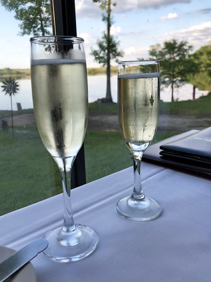 Champagne flutes with a million-dollar view. Nothing complements fine dining like bubbles and a serene waterfront sunset.
