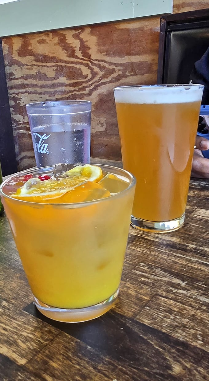 Cocktails that make you forget you came for the burger. That golden elixir on the left is calling your name.