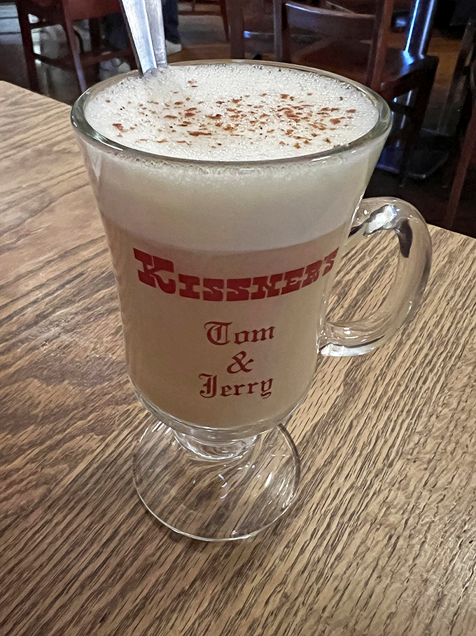 A frothy Tom & Jerry in a signature mug – the kind of warming winter tradition that makes Midwestern winters bearable.