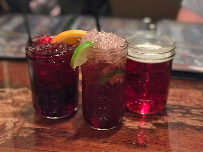 Cocktails that complement rather than compete with smoky flavors. These ruby-red concoctions with lime accents refresh between bites of rich barbecue.