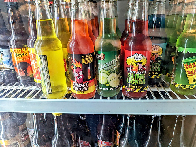 Vintage soda bottles lined up like liquid nostalgia, each flavor a ticket back to simpler times.