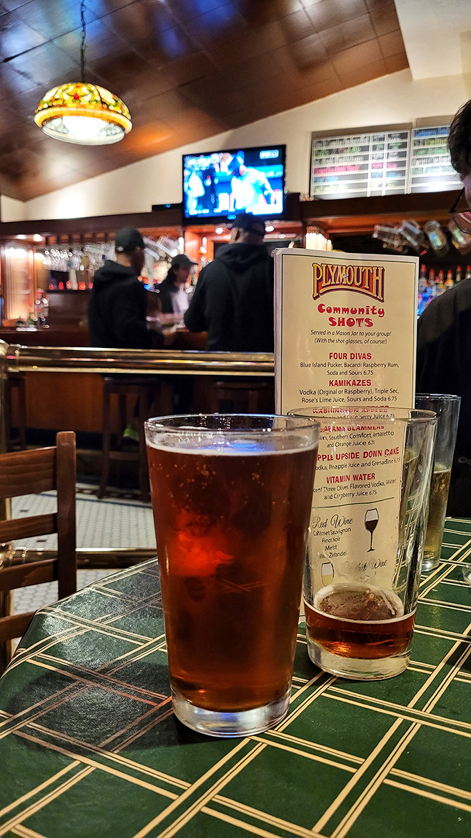 Cold beer and community shots – because sometimes the best conversations happen when glasses clink and sports fans unite.