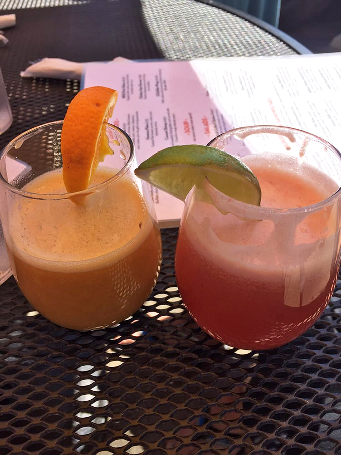 Brunch cocktails that make "it's five o'clock somewhere" feel like responsible adulting. That orange garnish isn't just for show.