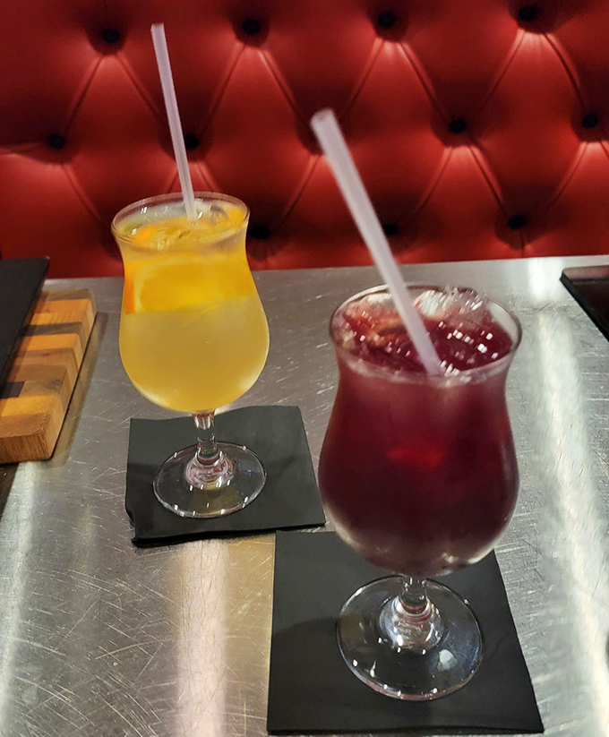 Cocktails that complement rather than compete with your steak. That red one is practically the same color as the banquettes&mdash;coincidence? I think not.