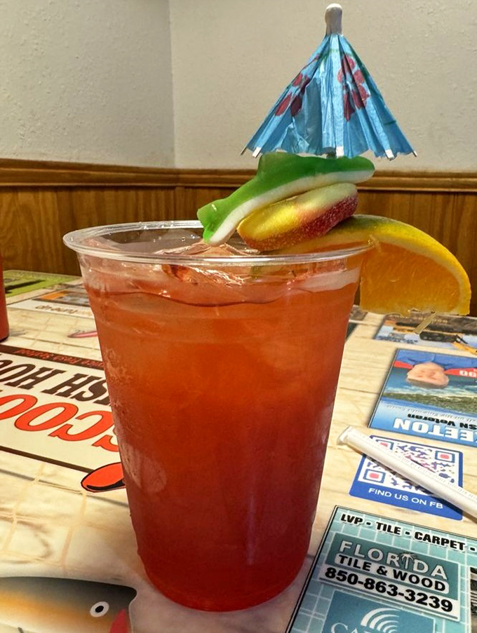 This isn't just a drink; it's a vacation in a cup. Complete with tiny umbrella and citrus garnish, it's Florida sunshine in liquid form.