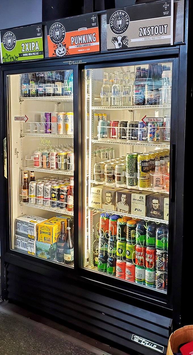 The drink cooler showcases an impressive array of local and craft beverages, because great sandwiches deserve equally thoughtful liquid companions.