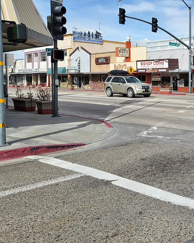Bishop's Main Street intersection showcases the town's blend of Western charm and modern convenience. Rusty's and Bishop Coins await your curiosity.