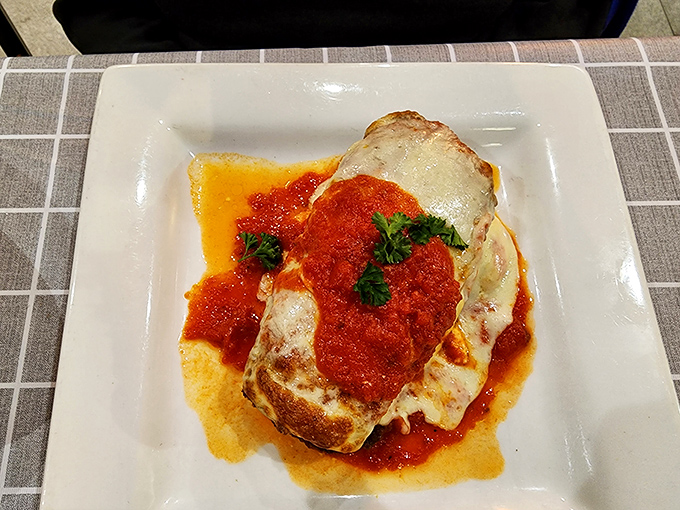 Eggplant parmigiana that might convert even the most dedicated carnivore. Swimming in marinara and melted cheese, it's vegetarian victory on a plate.