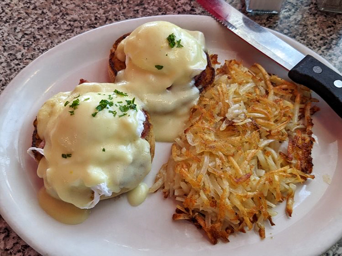 Eggs Benedict that balances decadence and technique—those perfectly poached eggs nestled on English muffins under a blanket of hollandaise.