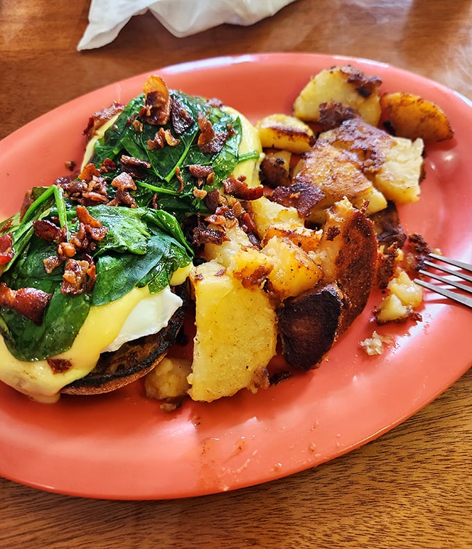 Eggs Benedict gets a spinach-bacon makeover that would make Popeye weep with joy. Those potatoes deserve their own fan club.