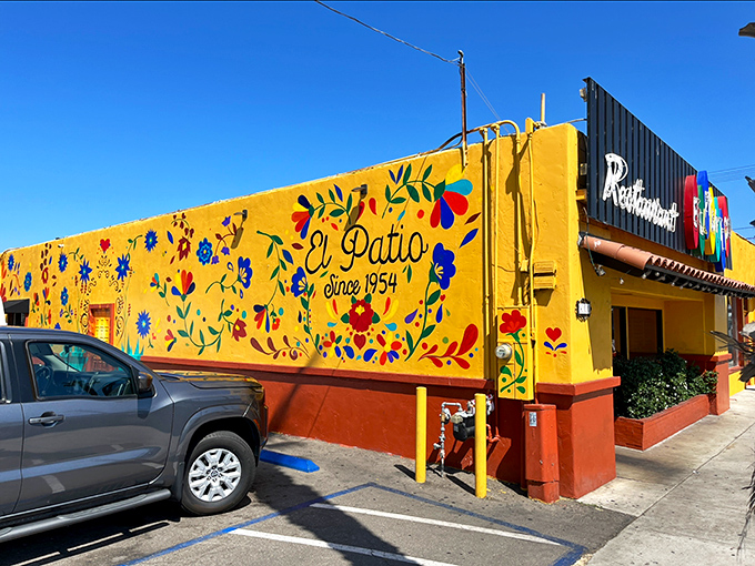 El Patio's vibrant yellow walls and colorful murals announce authentic Mexican flavors before you've even glanced at the menu.
