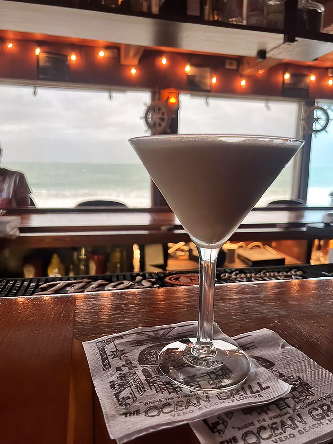 An espresso martini with the ocean as backdrop &ndash; because caffeine and alcohol with a view is basically vacation in a glass.