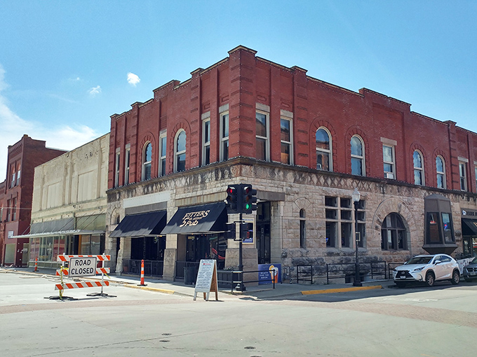 The Esser Building stands as testament to when architects believed corners should be round and bricks should be red.