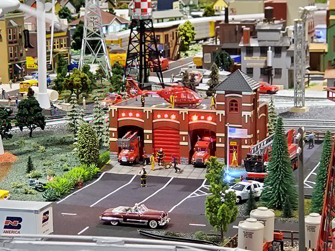 Emergency at the firehouse! The tiny firefighters are forever frozen in their heroic dash, while vintage cars wait at the perfectly painted crosswalk.