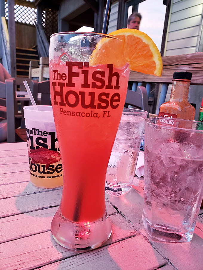 Nothing says "vacation mode activated" quite like a vibrant Fish House cocktail on the deck, with Pensacola Bay as your backdrop.