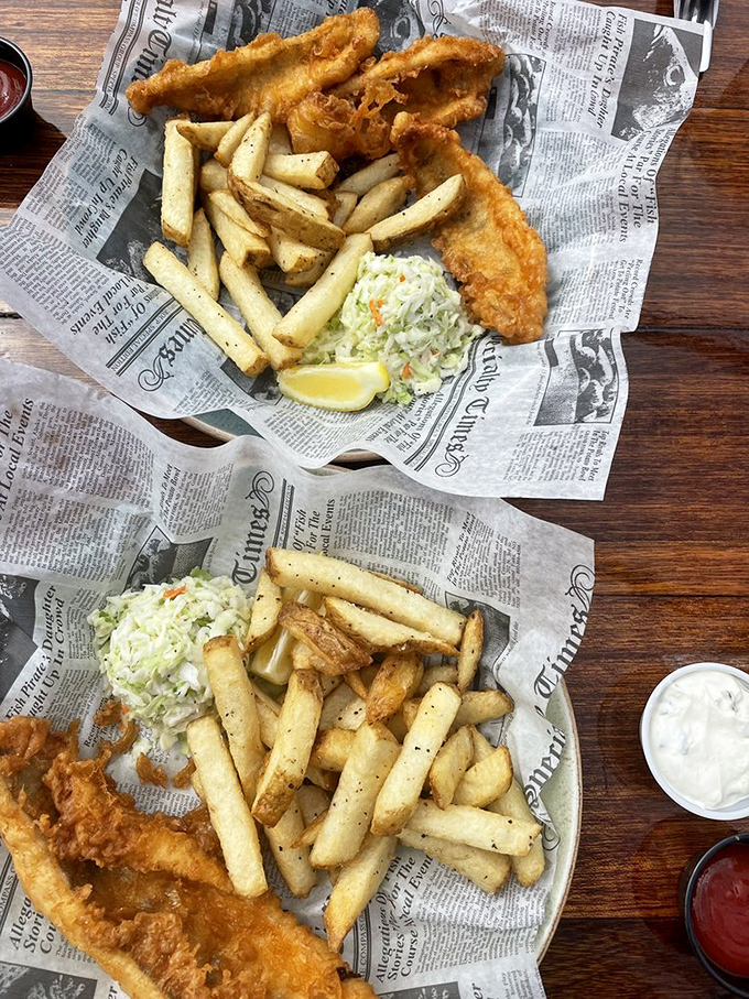 Fish and chips served on faux newspaper&mdash;a nod to tradition that says, "We respect the classics, but we're not getting actual newsprint on your food."