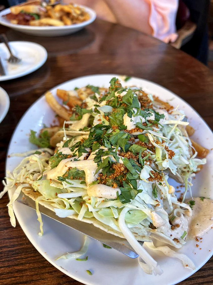 Freshness piled high. These tacos showcase the kitchen's commitment to vibrant flavors and textures, with crisp cabbage providing the perfect crunch. 