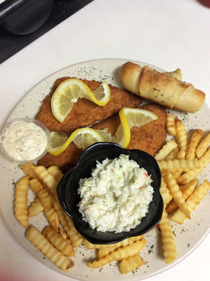 Crispy flounder that would make coastal towns jealous, served with creamy coleslaw and crinkle-cut fries that demand to be savored.