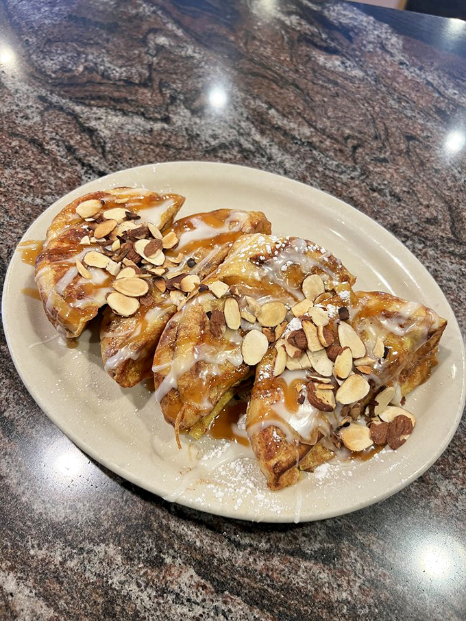 French toast that's dressed for success with sliced almonds and a drizzle that would make even maple syrup jealous.