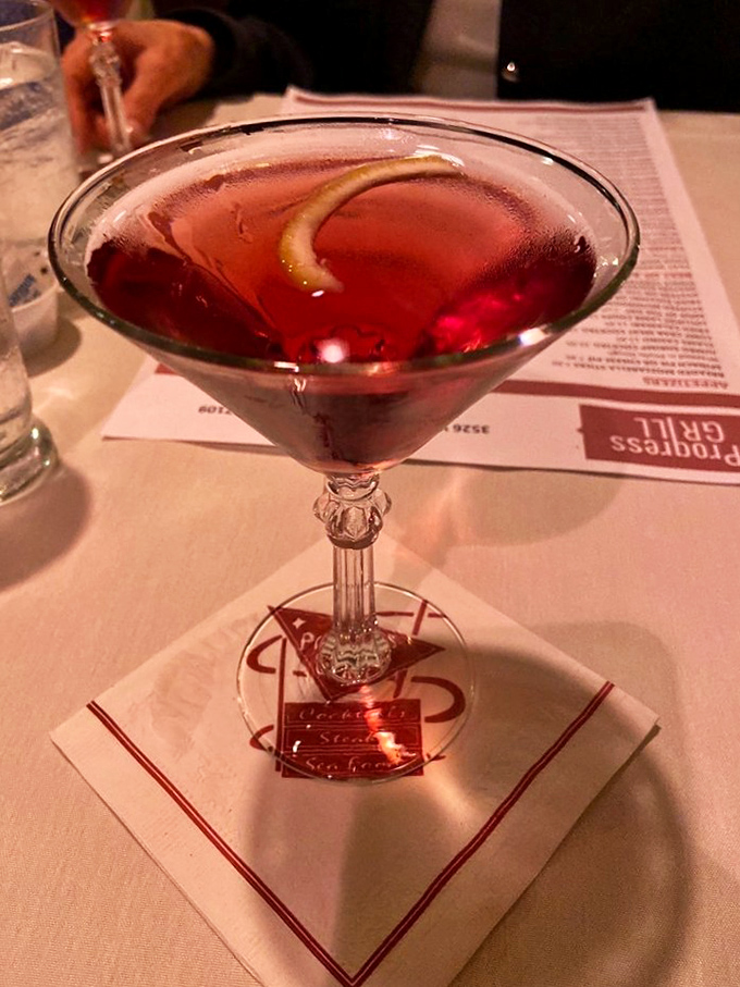 A classic cocktail served with old-school elegance—when's the last time your drink came with its own napkin and coaster?