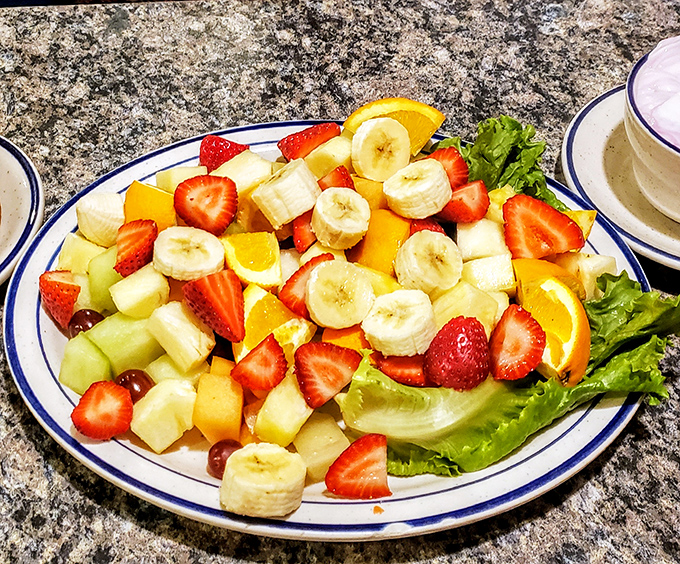 A fruit plate that actually looks like someone cared—vibrant, fresh, and arranged with the kind of attention usually reserved for first dates.