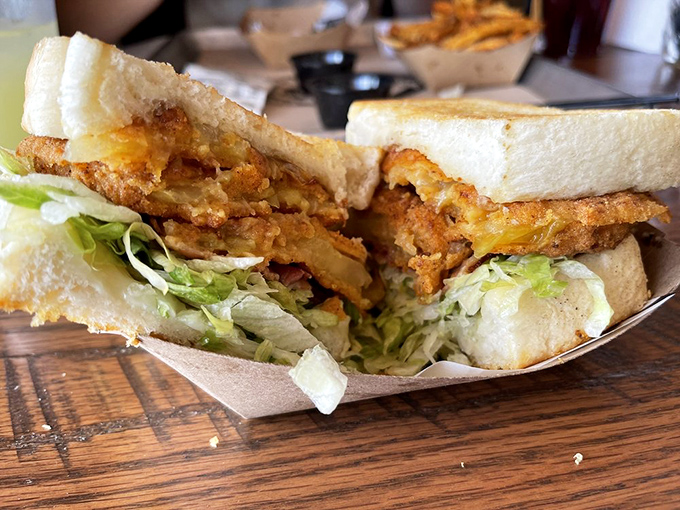 This isn't just a sandwich&mdash;it's architecture. Crispy fried goodness layered with fresh lettuce, creating the perfect textural symphony in every bite.